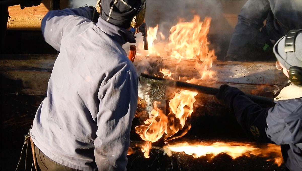 Smoke, fire and craftsmanship when putting iron rings on new yard ...